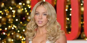 Sydney Sweeney Pairs White Lace Bra And Underwear With Sheer Robe