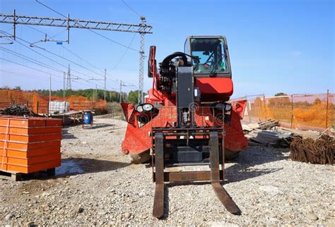Rotating Telehandler With Forklift Attachment During Railroad