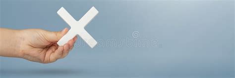 White Multiplication Symbol Or Cross In Hand The Concept Of