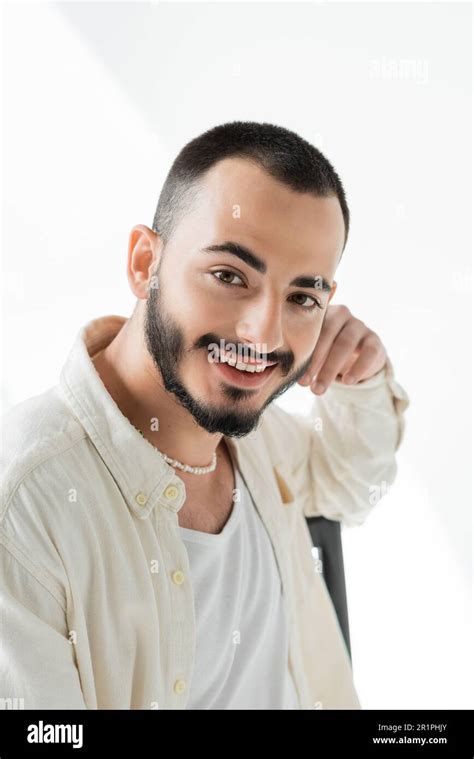 Portrait Of Cheerful Bearded Homosexual Man In Everyday Clothes Made Of