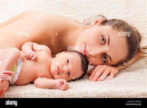 Happy Mother Holding Her Baby Stock Photo Alamy