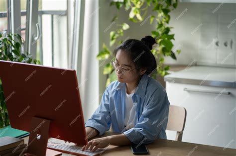 Premium Photo Focused Asian Woman It Developer Wearing Glasses