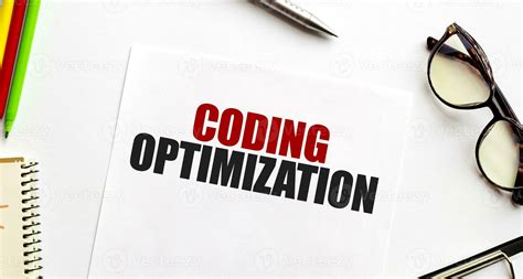 CODING OPTIMIZATION On Paper With Glasses Pen And Colourful Pencils Stock Photo At