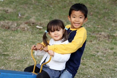 Japanese Brother And Sister On The Seesaw Stock Image Image Of Outdoor People 116073941