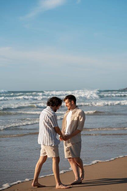 Free Photo Full Shot Gay Men Holding Hands At The Beach