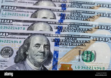 An Angled Partial View Of United States One Hundred Dollar Bills The