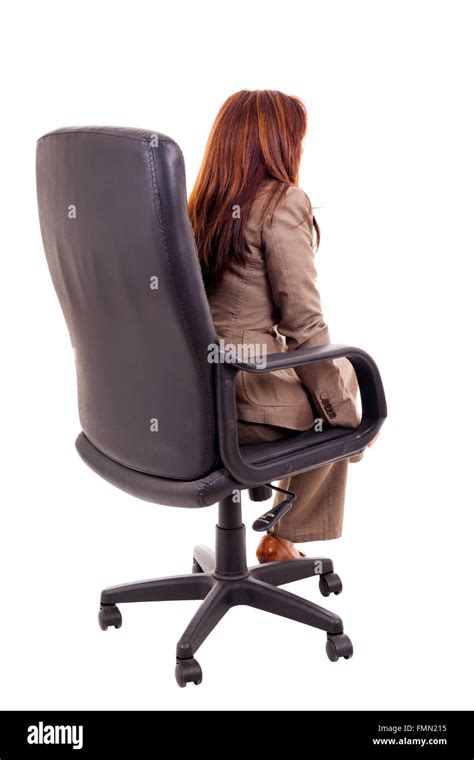 Rear View Of Young Woman Sitting On Chair Isolated Over White