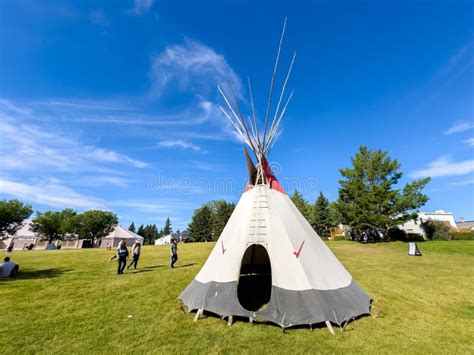 A Traditional Canadian First Nation Indigenous Teepee Stands Tall On A Grassy Field Its