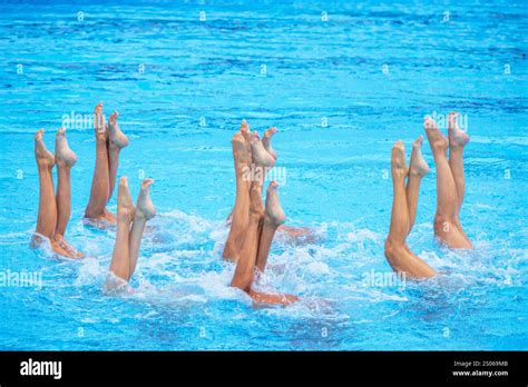 Artistic Swimming Team Performing Synchronized Legs Choreographed