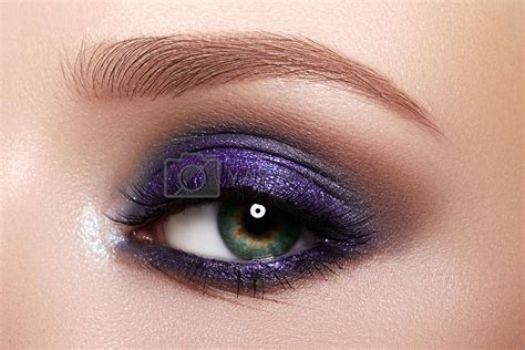 Closeup Macro Of Woman Face With Purple Eyes Makeup Fashion Celebrate