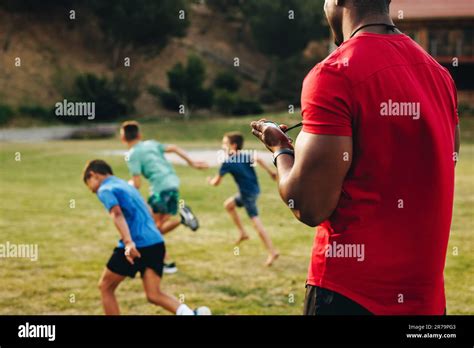 Sports Trainer Coaching A Primary School Team Pe Teacher Having A