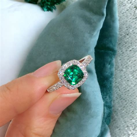 Princess Emerald Cushion Cut Halo And Two Emerald Half Eternity