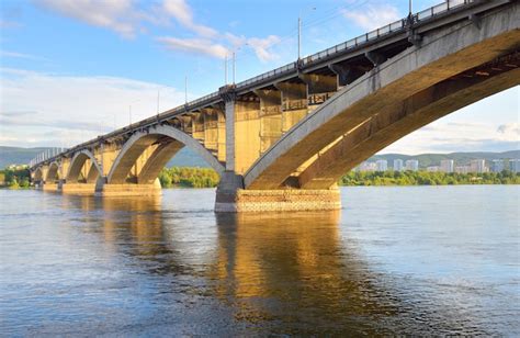 Premium Photo Arched Bridge Over The Yenisei River Under A Blue Sky
