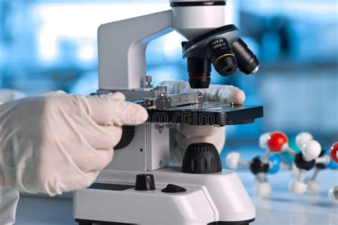 Research Microscope With Molecule Structural Formula And Periodic Table