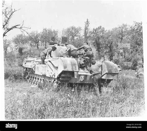 The Crew Of A Churchill Tank Board Their Vehicle And Move To Action