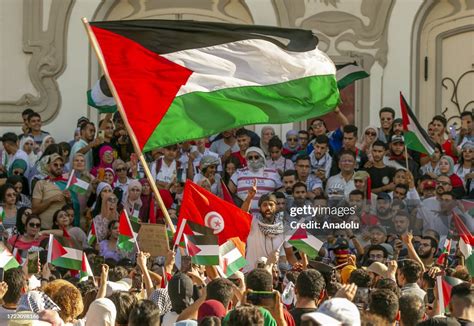 Hundreds Of People Wave Palestinian Flags And Shout Slogans Against
