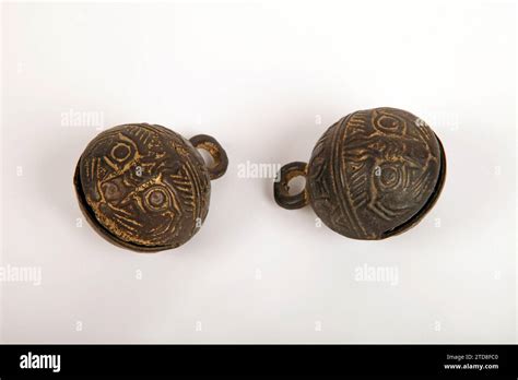 Pair Of Small Chinese Bronze Jingling Bellsdecorated Withy A Face