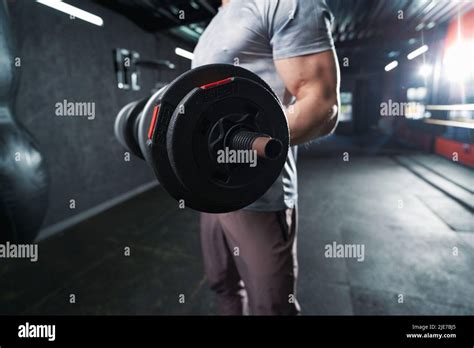 Sportsman Performing Strength Training Exercise With Hand Weights Stock