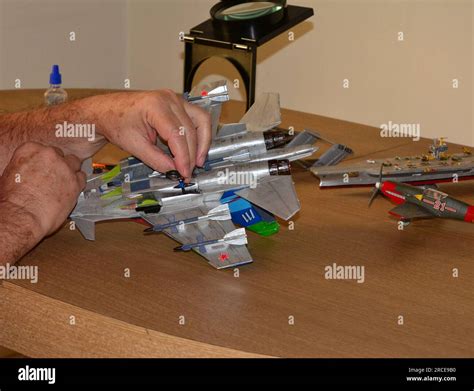 Plastic Model Kit Man Using Hands To Assemble Scale Model Brazil