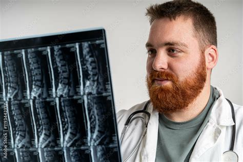 Neurologist And Surgeon Examine A Patients Spine Image Radiologist Doctor Examining Spinal