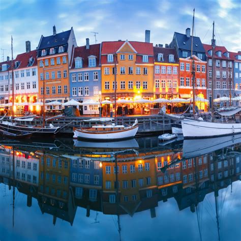 Panorama Shot Of The Nyhavn District Of Copenhagen With Reflections Of