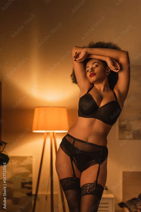 Sexy African American Woman In Black Underwear And Stocking Posing With