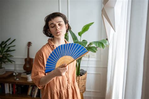 Sad Weary Woman With Fan Enduring Extreme Summer Conditions Heat