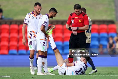 Luke Ivanovic Of The Glory Receives Attention From A Team Mate During