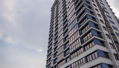 Premium Photo Building Facade Reflection In Glasses Against The Sky