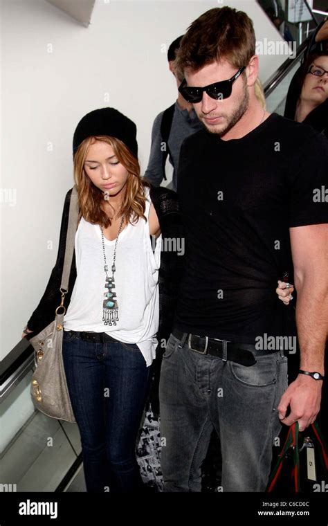 Miley Cyrus And Liam Hemsworth Miley Cyrus Arrives At Lax Airport On A
