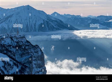 Layer Of Clouds With Tyndall Effect At The Flank Of Mount Niesen At The Entrance Of Simmental