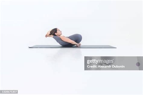 Legs Behind Head Yoga Pose Photos And Premium High Res Pictures Getty