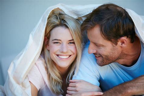 He Makes Me Light Up On The Inside Portrait Of A Young Couple Lying In