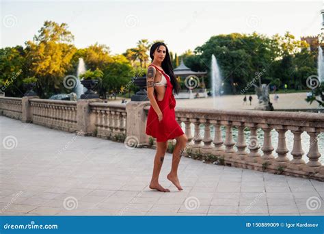 Ladyboy Tattooed Transgender Model Is Dancing In The Green Park Stock