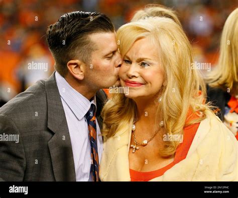 Annabel Bowlen Smiles As John Bowlen Kisses Her On The Cheek During The