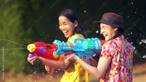Asian People Are Using Water Guns Play Songkran Festival In The Summer
