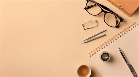 A Pair Of Eyeglasses Glasses And A Notebook On A Table Premium Photo
