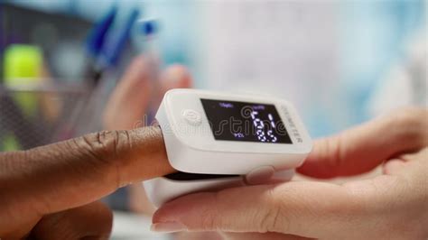 Medical Specialist Takes Oxygen Saturation Measurement And Checking