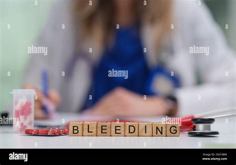 a healthcare professional is actively examining a patients bleeding