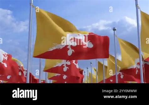 Fluttering Bhutan Flags On Blue Sky Background Prosperity Concept The
