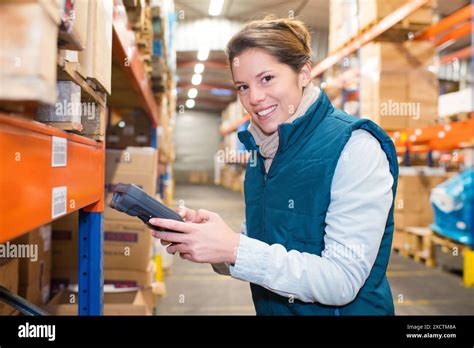 Woman Holds Scanner And Scans Barcode With Laser Stock Photo Alamy