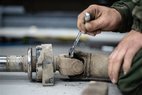 The Manand X27s Hands Disassemble The Shaft Of The Car Close Photo