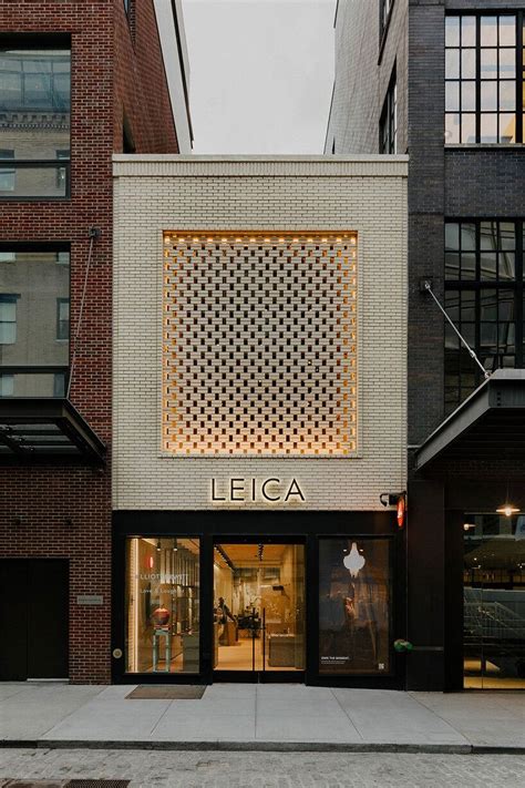 Brick Screen Facade Highlights Leica Store And Gallery In Revitalized