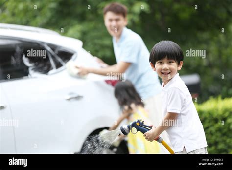 Boy And Girl Helping Father Cleaning Car Stock Photo Alamy