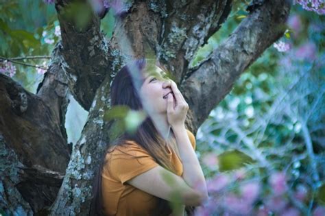 Premium Photo Woman Looking At Tree Trunk
