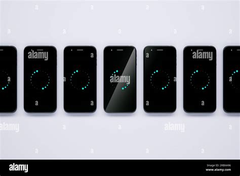3d Rendering Of A Set Of Smartphones Displaying Sync Icons Synchronizing In Progress Sync Data