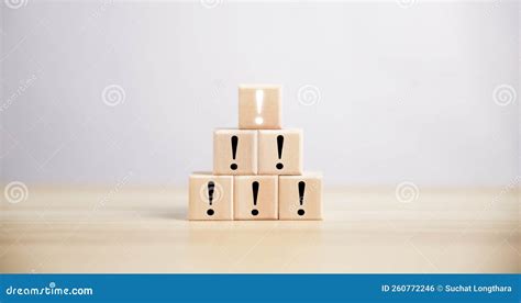 The Wooden Block Shows A Black And White Exclamation Mark Business