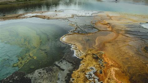 A Landscape Of Bubbling Colorful Geothermal Pools Used To Harness