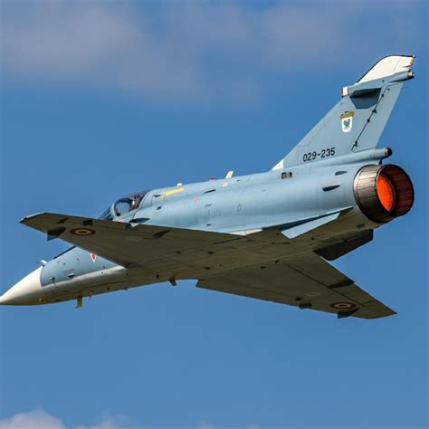 A Jet With The Word Navy On The Tail Is Flying In The Sky Premium Ai