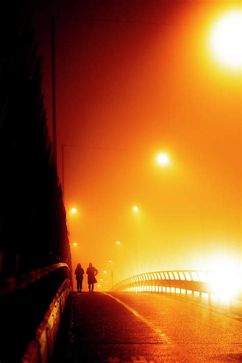 Amber Crossing Figures In Golden Fog Misty Bridge Night